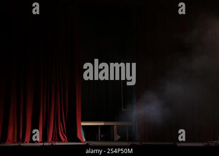 Smoke on dark stage in modern theatre Stock Photo - Alamy
