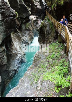 Wooden bridge above river in spring forest Stock Photo - Alamy