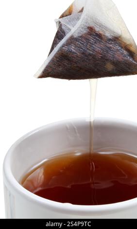 mug with brewing tea and tea bag close up isolated on white background ...