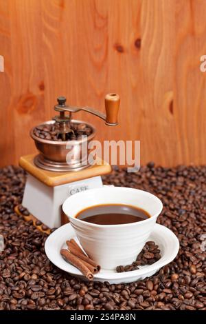 coffee beans cinnamon and coffee grinder Stock Photo - Alamy