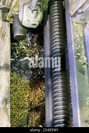 metal turning in sump of lathe machine in turnery Stock Photo - Alamy