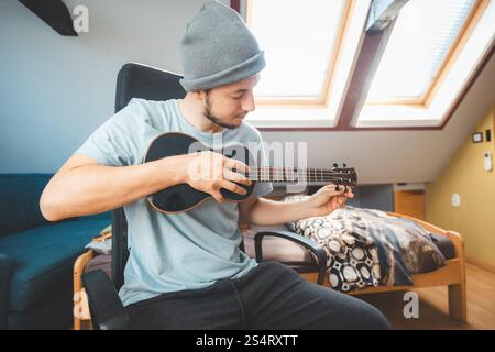 Happy man feeling comfortable, wearing warm sweater and hugging himself ...