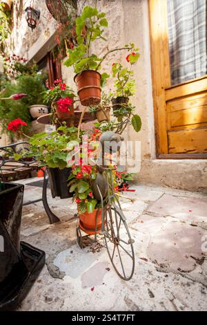 Bicycle flower bed. Decorative vintage bicycle shape stand with yellow ...