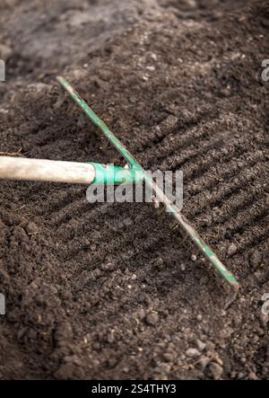 A woman preparing to plant a seed with seedling in the Flemo Farm ...