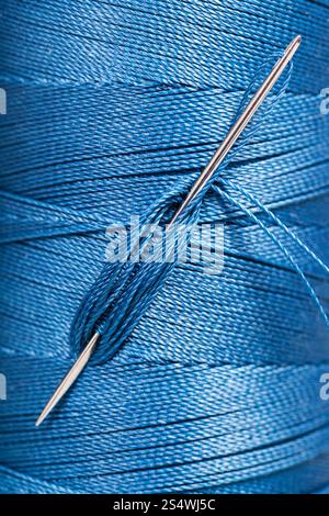 Spool of Thread and Needle. close-up Stock Photo - Alamy