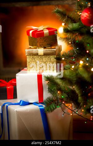 Colorful gift boxes and christmas tree Stock Photo - Alamy