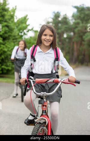 smiling little girl in helmet with paint brush Stock Photo - Alamy