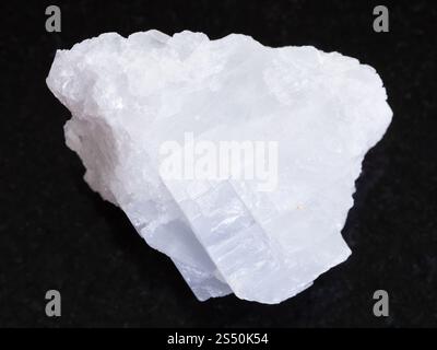 rough crystalline Magnesite stone on dark Stock Photo - Alamy