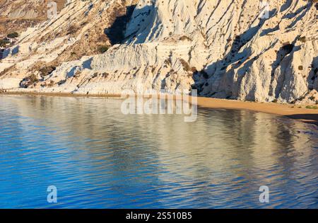 Sandy beach under famed white cliff, called Scala dei Turchi", in ...