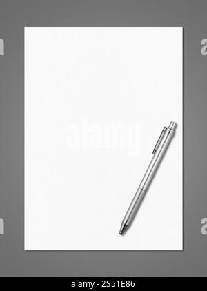 Notepad with a pen and clean sheets of white paper on yellow wooden ...