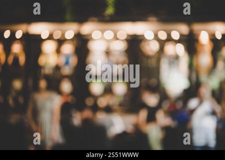 abstract blur image of night festival with a street walk and led light ...