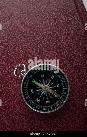 Compass over on red leather background. Travel concept Stock Photo - Alamy