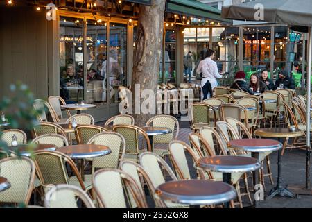 An empty cafe filled with chairs and tables along with interior ...