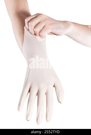 front view of female hand pulls latex glove on another hand isolated on ...