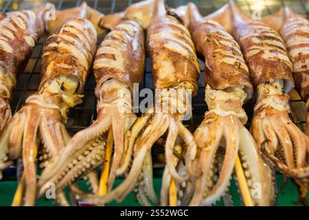 grill squid at the seafood and fish market at the Naklua Fish Market in ...