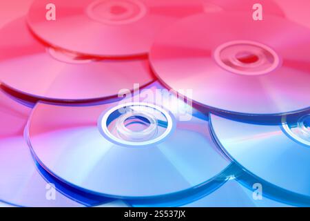 Colorful CD, DVD stack wallpaper background Stock Photo - Alamy