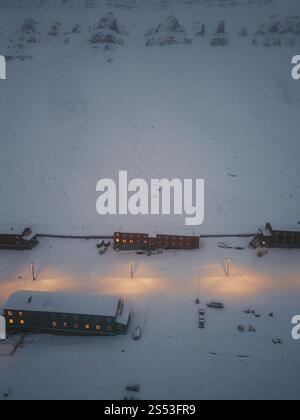 Drone shot of snowy hostel in Nybyen neighbourhood in Longyearbyen ...