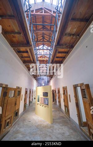 View of a typical multistory, catwalk, cell wing with wood doors. At ...
