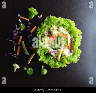 a food bowl with mixed vegetables and dressing, overhead view Stock ...