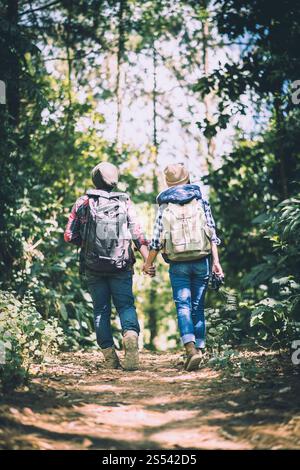 Two woman with backpacks walking in the old Tallinn, Estonia Stock ...