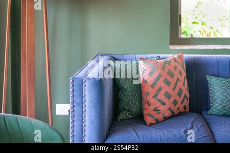 Sofa with colorful pillows in room Stock Photo - Alamy