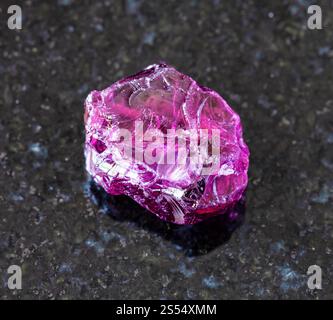 Natural gemstone pink rhodolite garnet on gray background Stock Photo ...