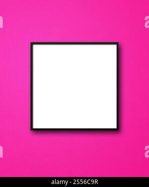 Empty square frame on pink background next to monstera leaf Stock Photo ...