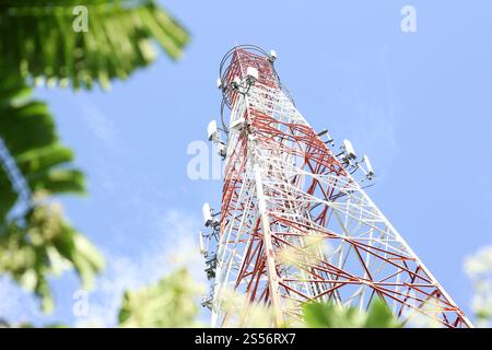 Internet signal tower or mobile phone signal tower is isolated on blue ...