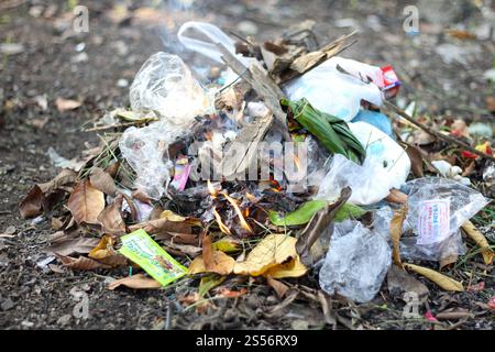 People burning trash household waste Stock Photo - Alamy