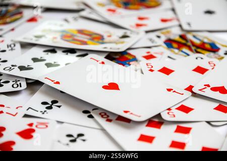 Classic playing card game laid out on a table. White background ...