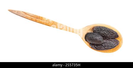 top view of dried tonka beans in black bowl isolated on white ...