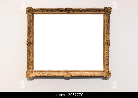 old decorated narrow picture frame with cutout canvas on gray wall ...