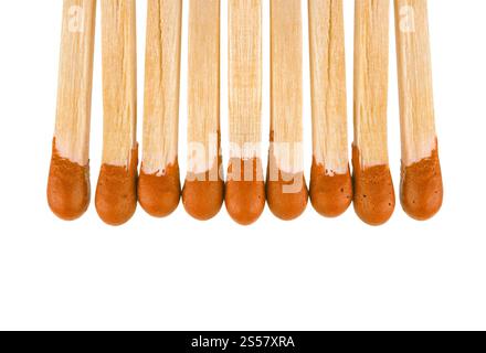 Matches on a white isolated background. Matches on a wooden background ...
