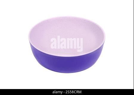 empty rustic terracotta kitchen bowl and spoon on a wooden tabletop ...