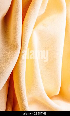 background of bright yellow silk with waves texture. background of ...