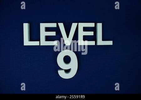 Level 9 Level Nine alphabet letters on navy blue background Stock Photo ...