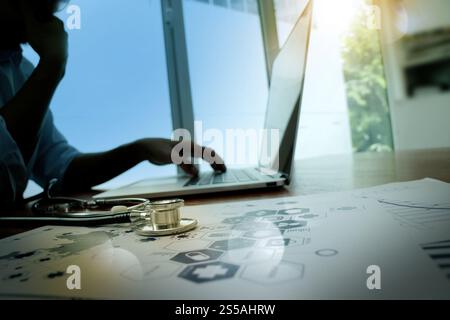 Workplace of a doctor. Stethoscope and smart phone on wooden desk ...