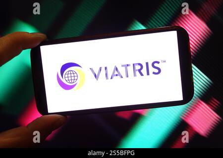 In this photo illustration, the Viatris logo is seen displayed on a ...