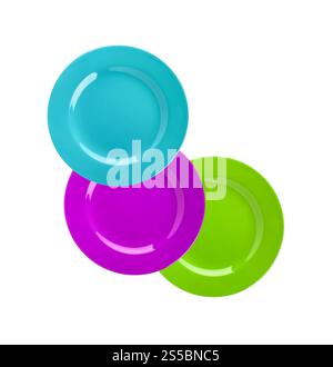 Set of clean color plates on table Stock Photo - Alamy