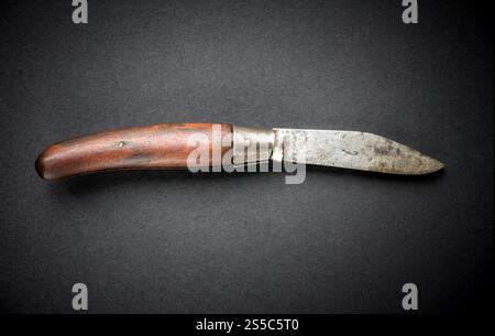 Traditional wooden pocket knife on a black background Stock Photo - Alamy