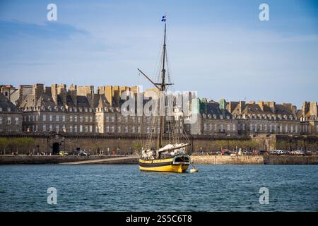 Old corsair ship in the port of Saint-Malo at sunset, Brittany, France ...