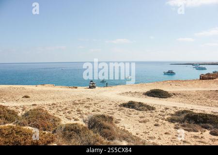 Long distance view of Cape Cavo Greco in summer Stock Photo - Alamy
