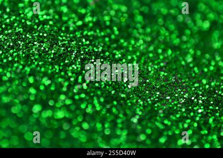 A huge amount of green decorative sequins. Background image with shiny ...