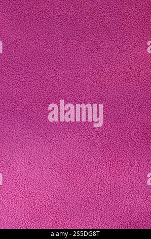The blanket of furry pink fleece fabric. A background of light pink ...