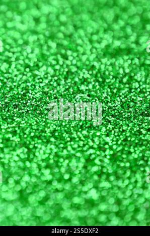 A huge amount of green decorative sequins. Background image with shiny ...