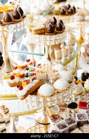 Luxurious candy bar buffet displaying a variety of delicious pastries ...