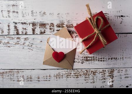 Valentines day greeting concept with envelope filled with small gold ...