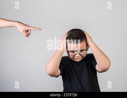 Boy feels sad after the parents scold him Stock Photo - Alamy