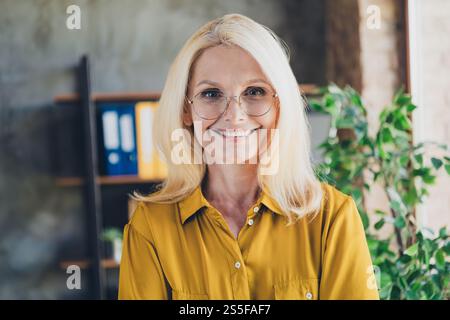 Photo of sweet charming lady assistant wear shirt arms crossed indoors ...