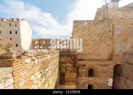 Ancient stone ruins with arches under a blue sky, a blend of history ...